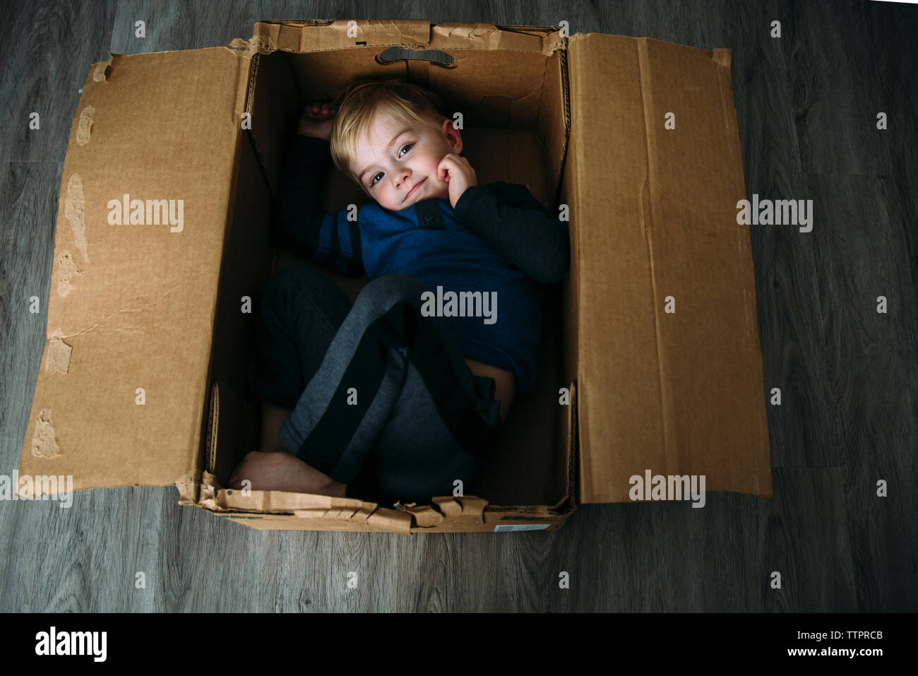 Boy in the box hi-res stock photography and images - Alamy