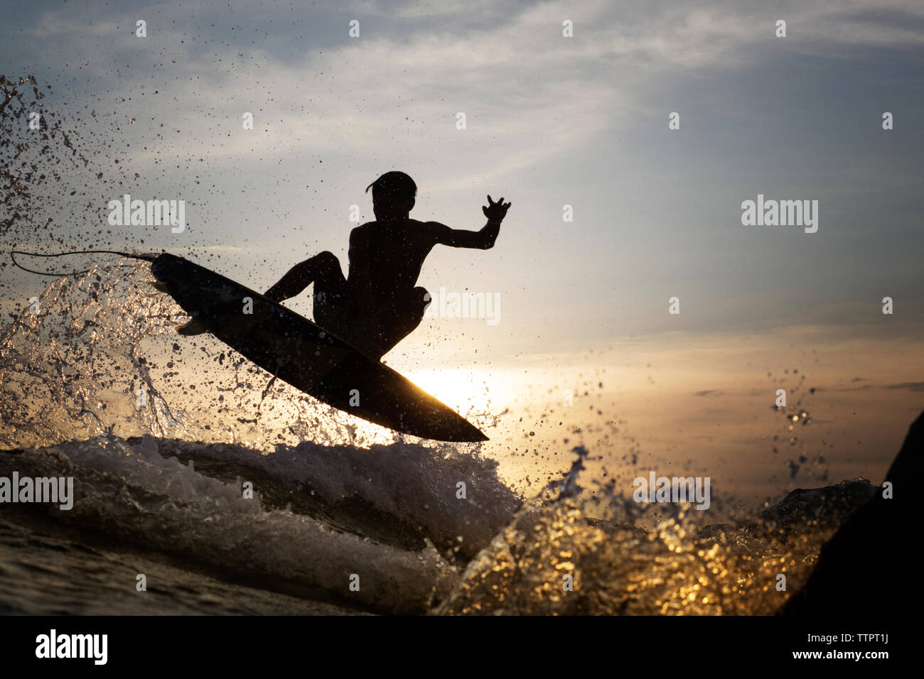 Jumping over the waves hi-res stock photography and images - Alamy