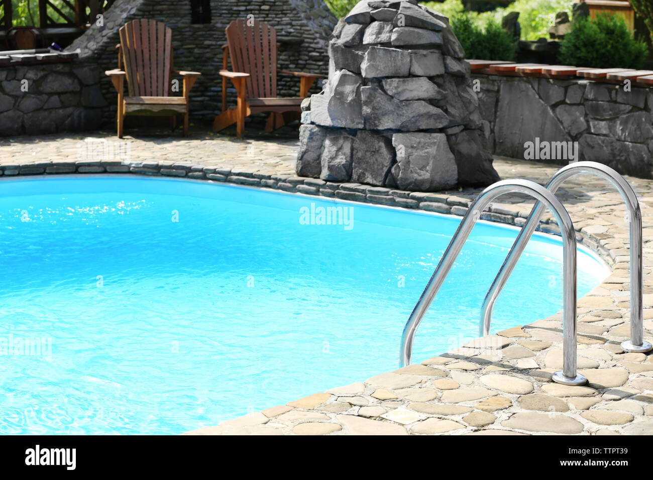 Swimming pool in summer yard Stock Photo - Alamy