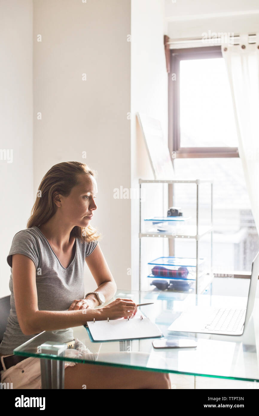 Woman working on glass table hi-res stock photography and images - Alamy