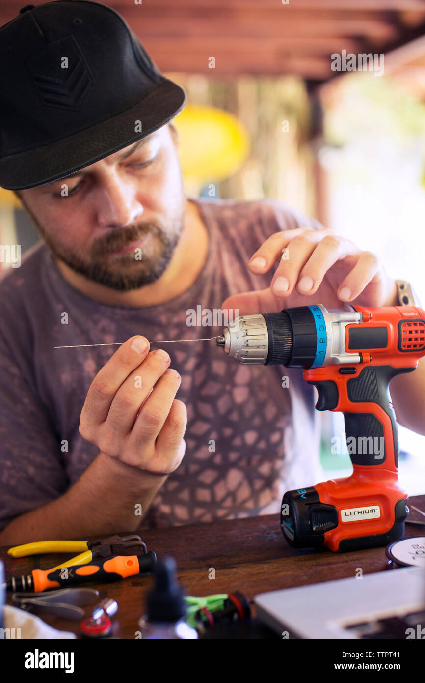 Male worker repairing table hi-res stock photography and images - Alamy