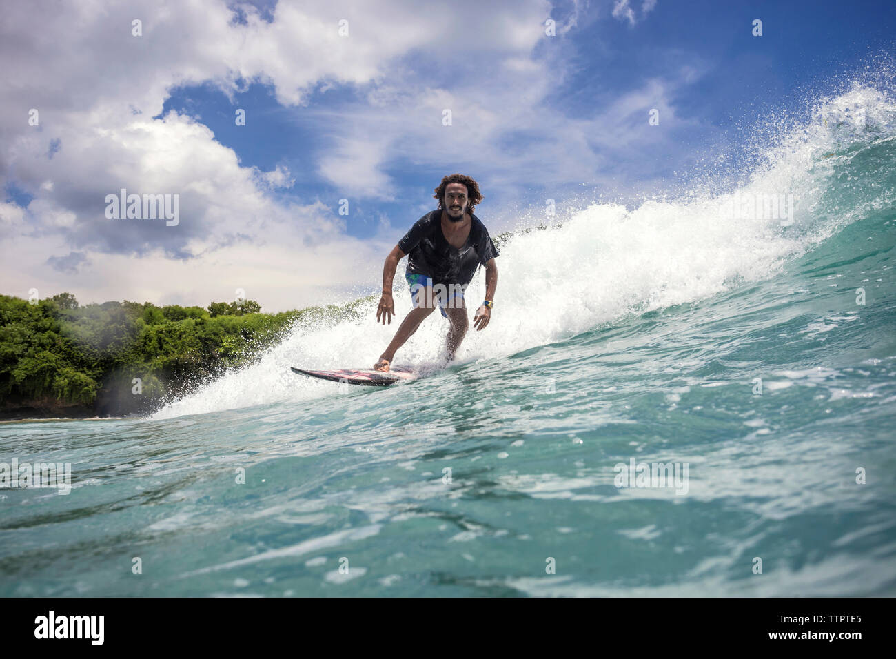 Man surfing on sea hi-res stock photography and images - Alamy