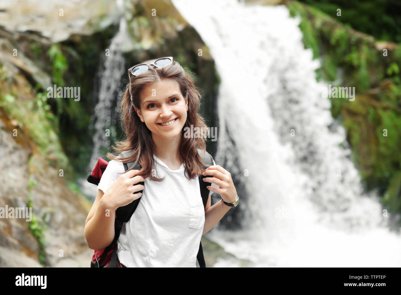 Female tourist standing beside the mountain river Stock Photo - Alamy