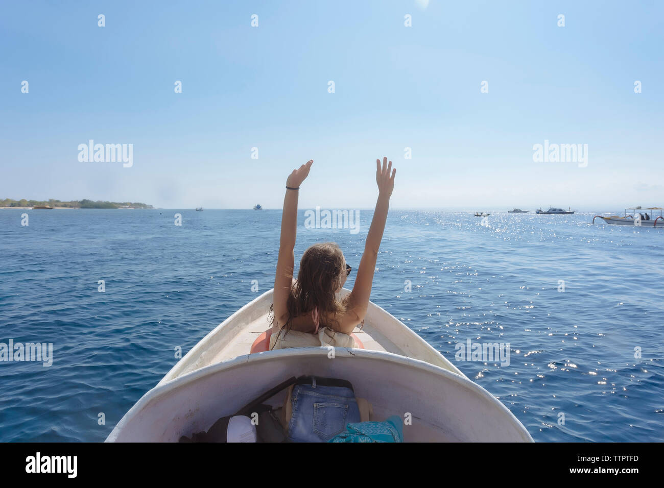 Woman arms raised rear view sky hi-res stock photography and images - Alamy
