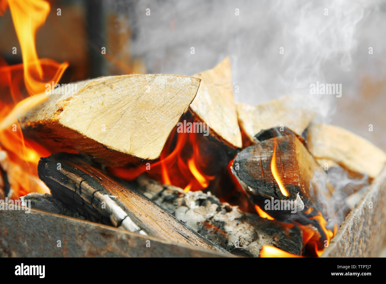 Burning wood in brazier, closeup Stock Photo - Alamy