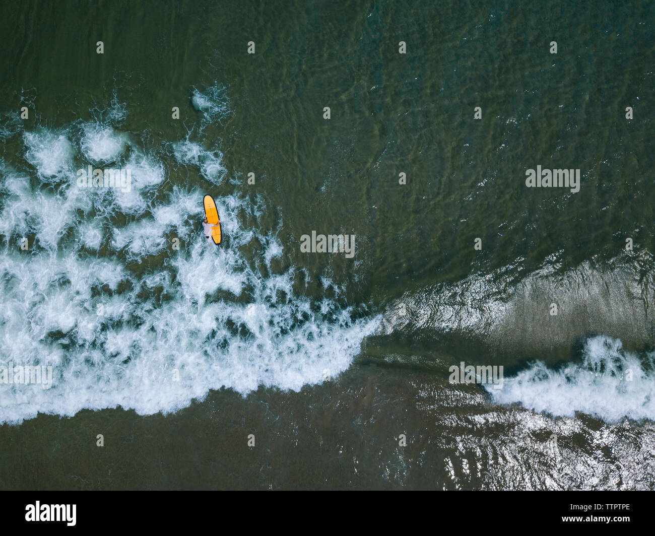 Aerial view of man surfing on sea at Bali Stock Photo - Alamy