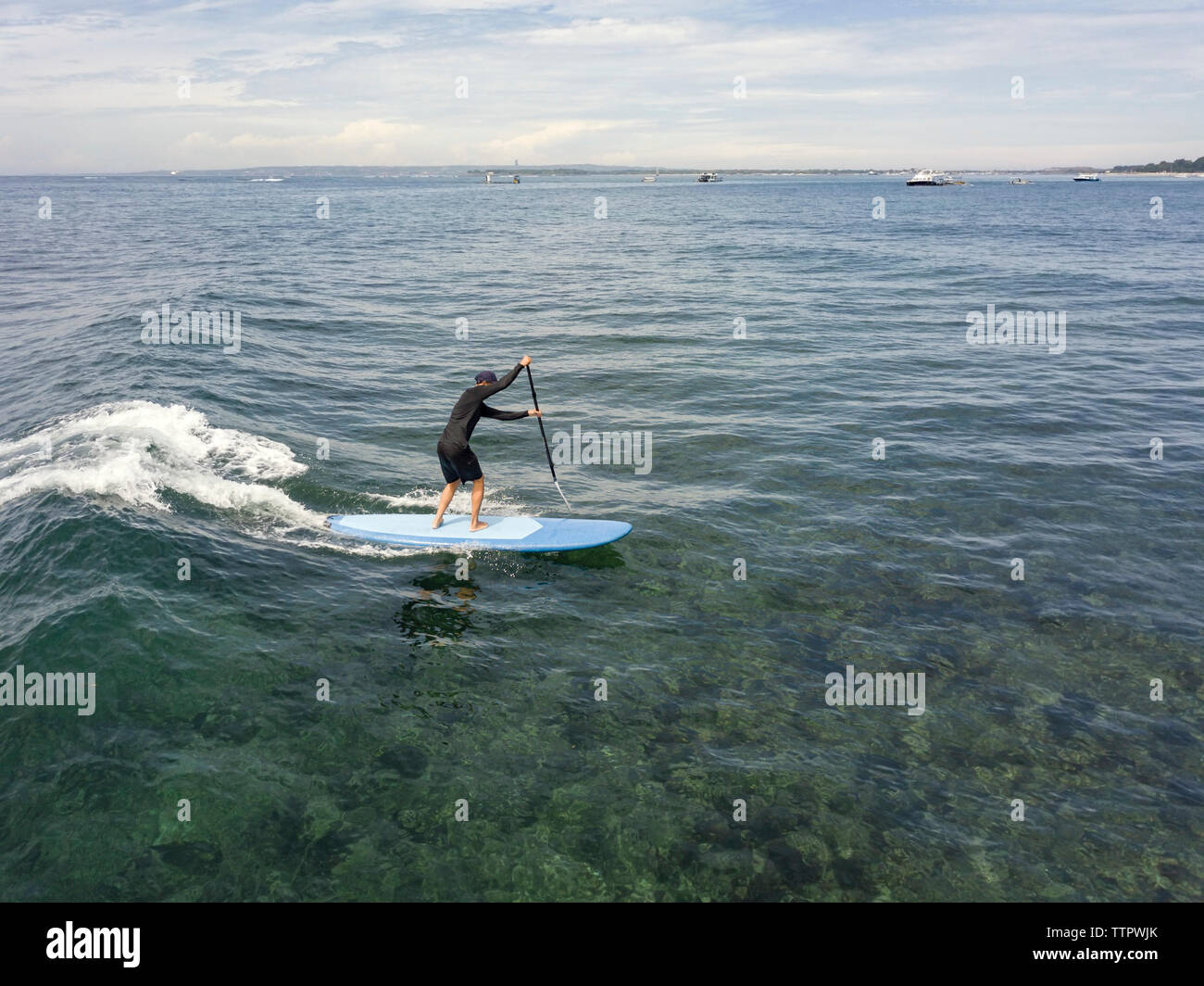 Aerial view of stand up paddle surfing Stock Photo - Alamy