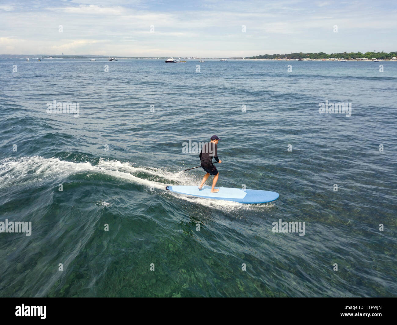 Aerial view of stand up paddle surfing Stock Photo - Alamy