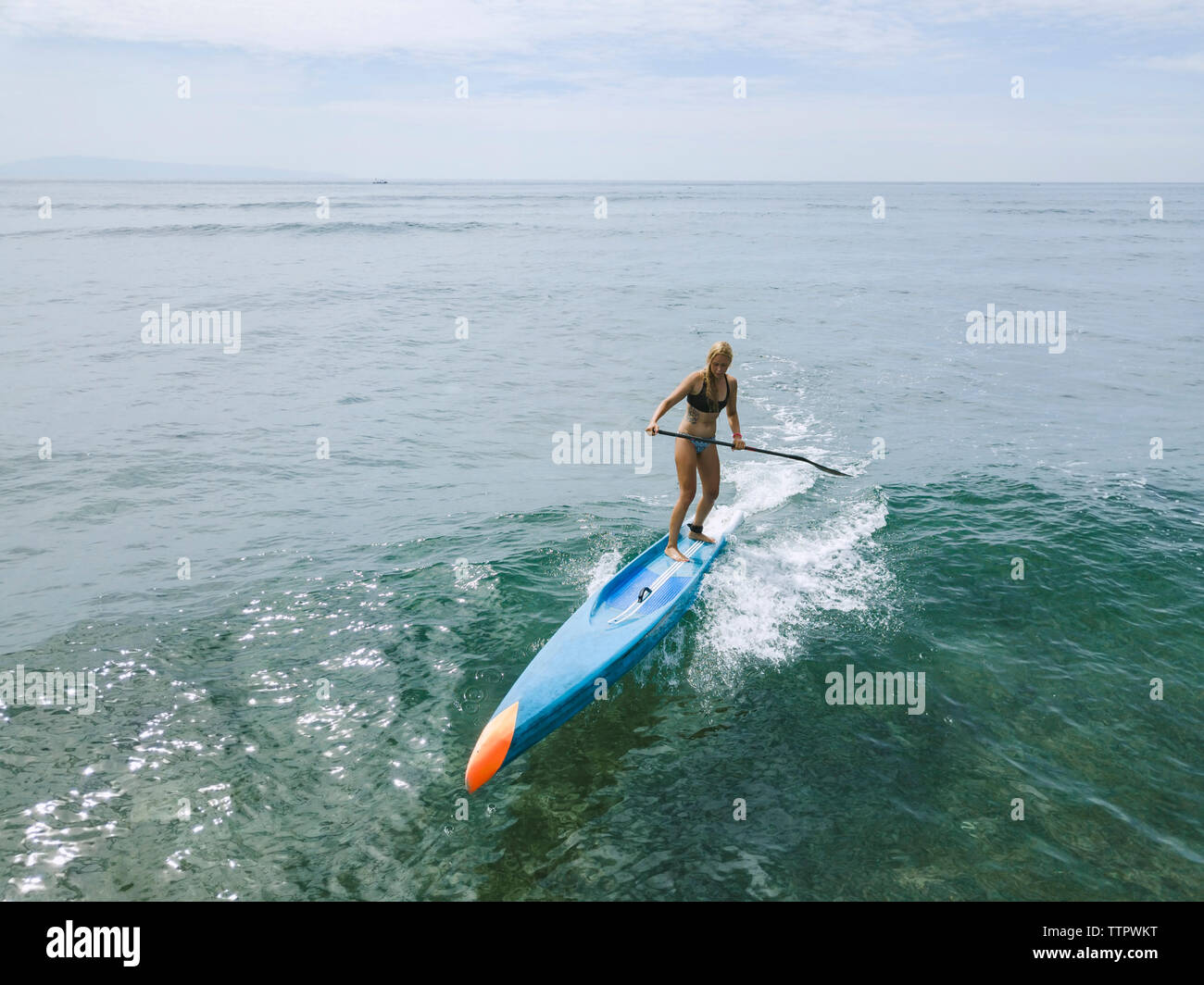 Woman paddling board hi-res stock photography and images - Alamy