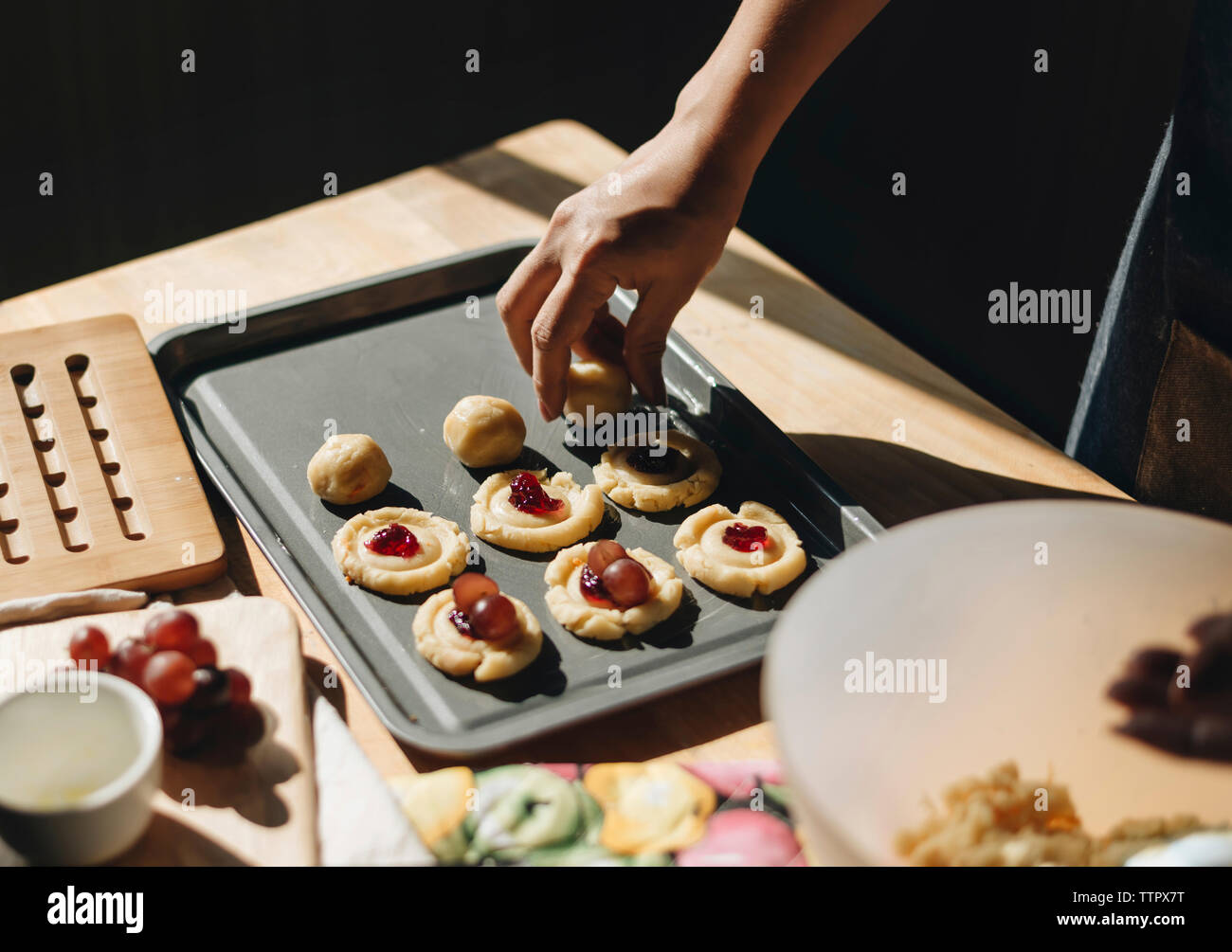 Old woman baking cookies hi-res stock photography and images - Alamy