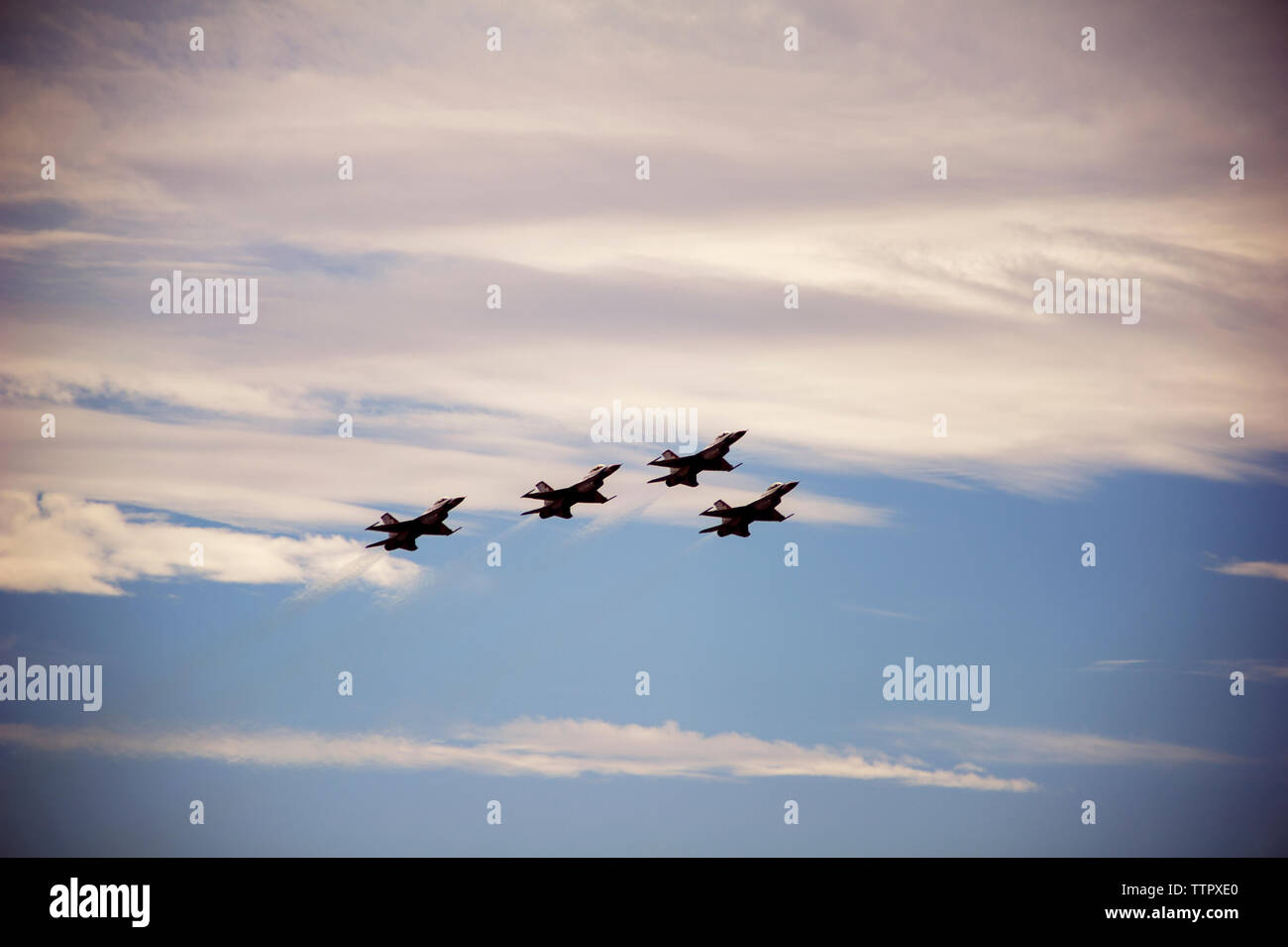 Low angle view of fighter planes flying in sky during airshow Stock ...