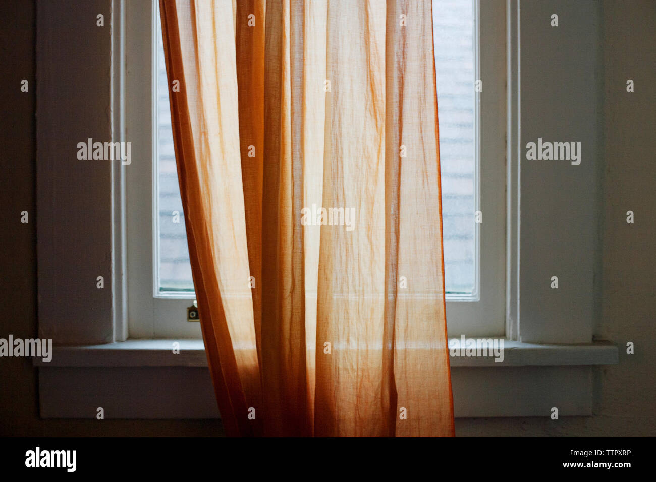 Close-up of curtain hanging against window Stock Photo - Alamy