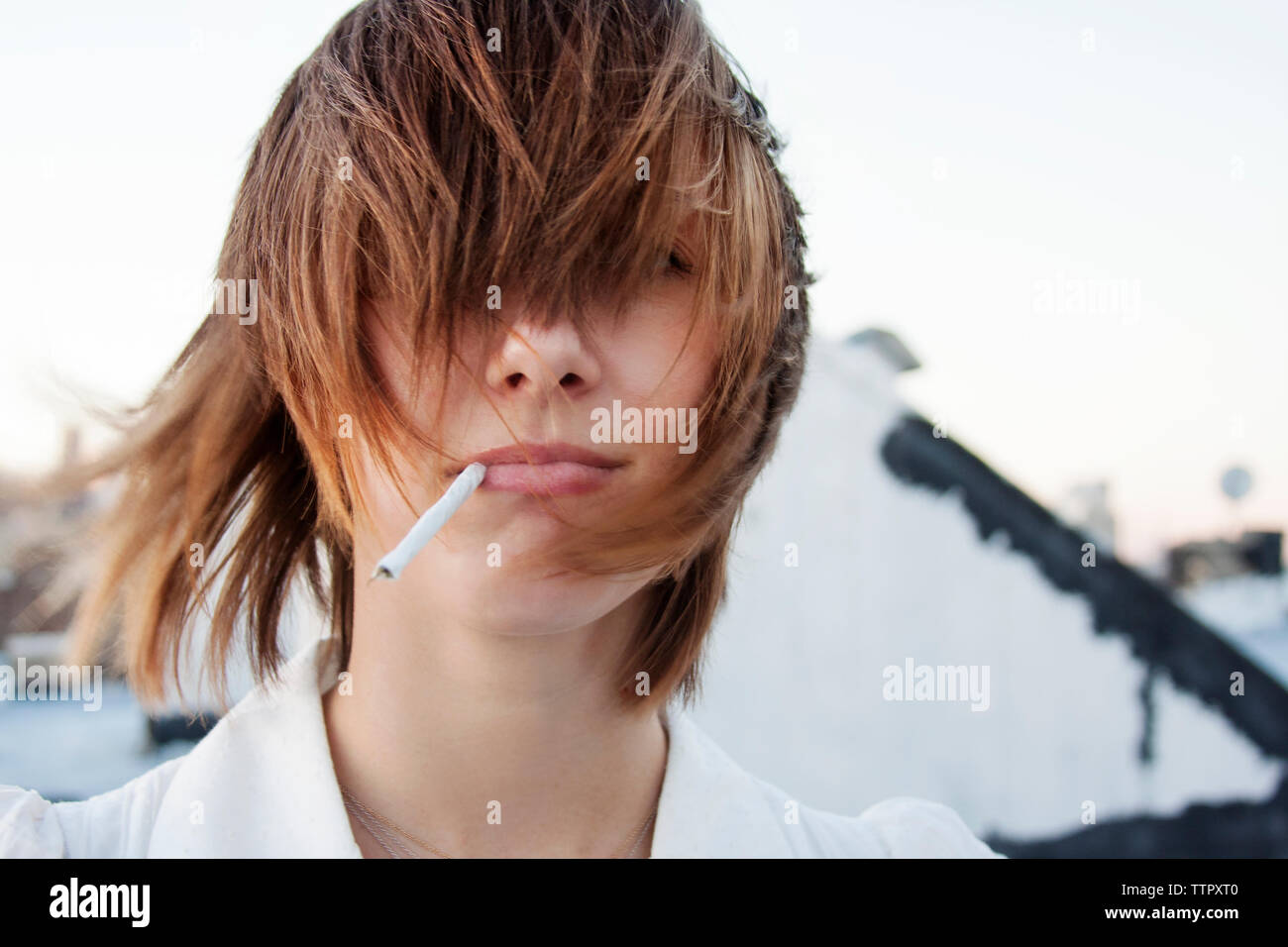 Woman smoking cigarette bangs hi-res stock photography and images - Alamy
