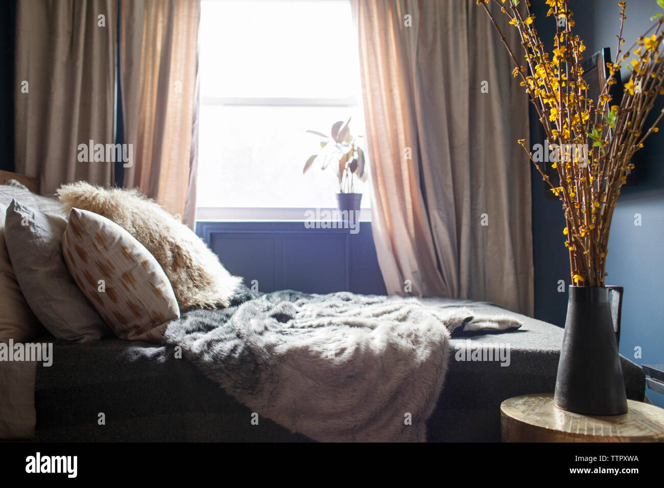 Interior of brightly lit bedroom Stock Photo - Alamy