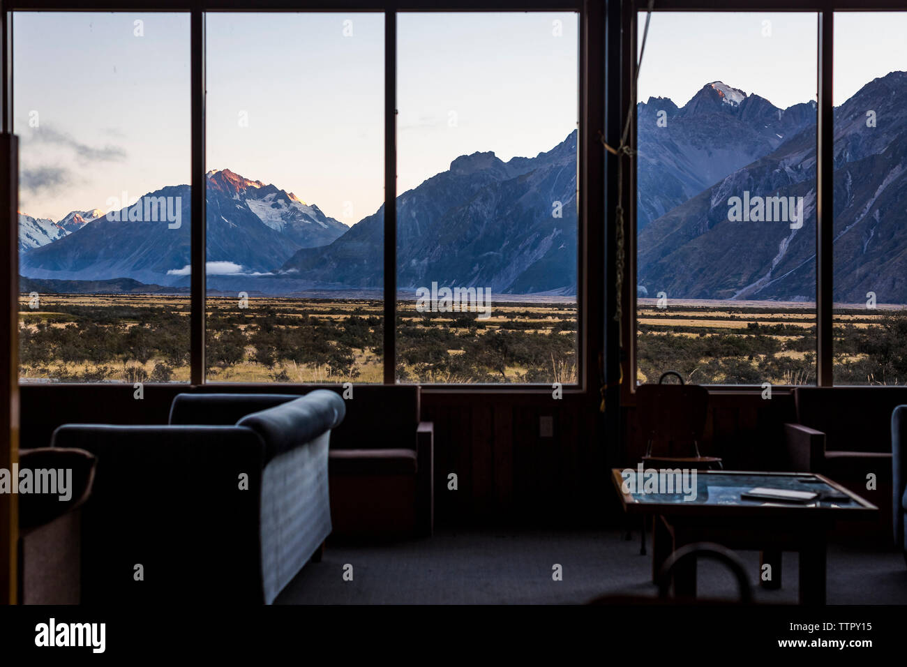 Mountain landscape seen through windows of a lodge in New Zealand Stock ...