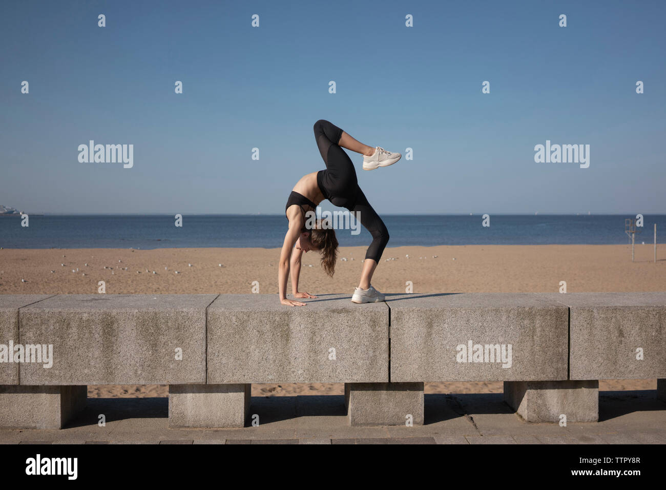 Young Woman Bending Over Backwards High Resolution Stock Photography ...