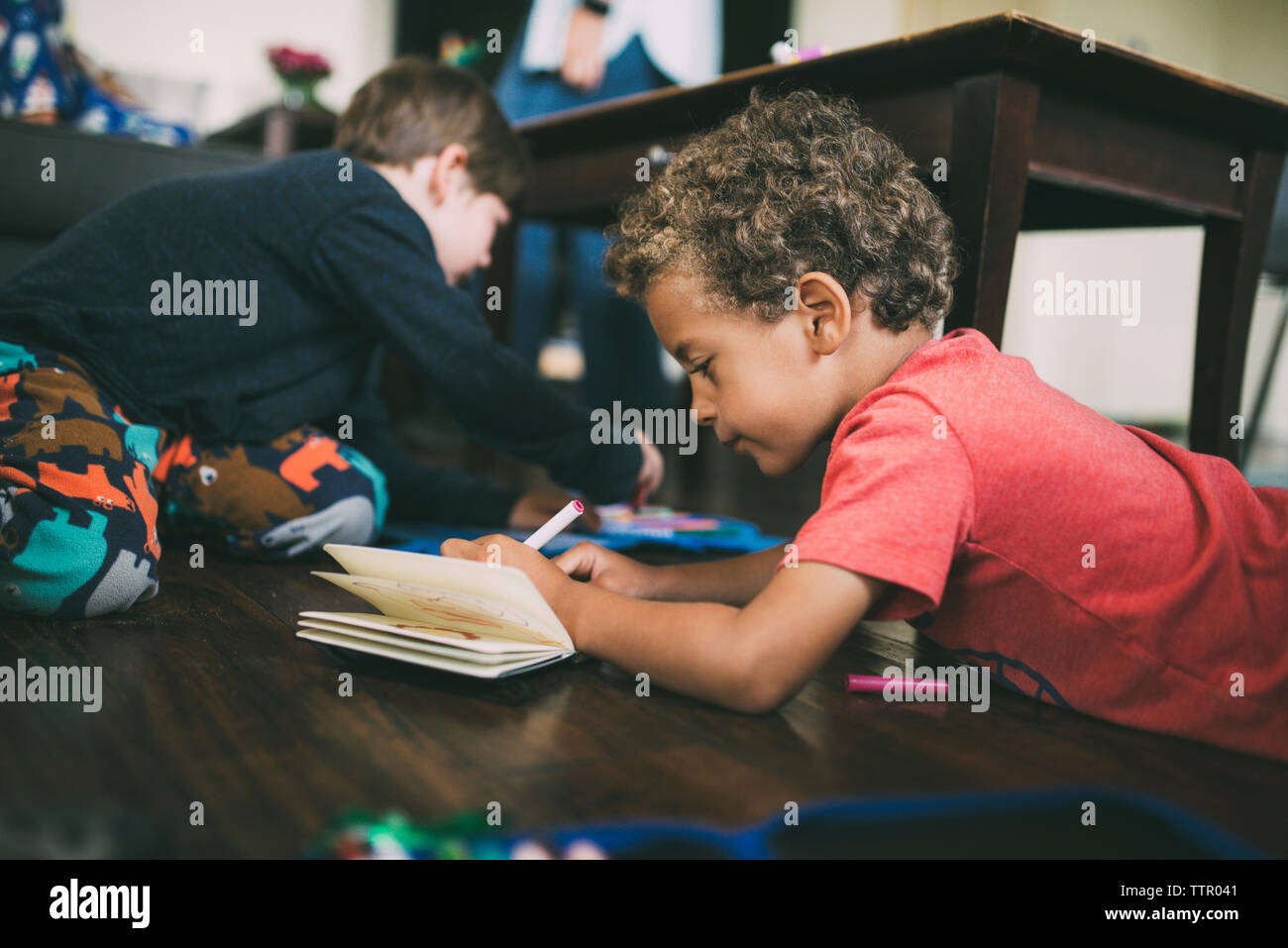 Family doing homework together home hi-res stock photography and images ...