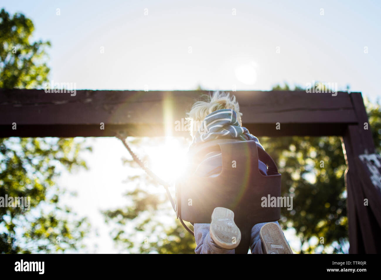 Boy swing low angle hi-res stock photography and images - Alamy