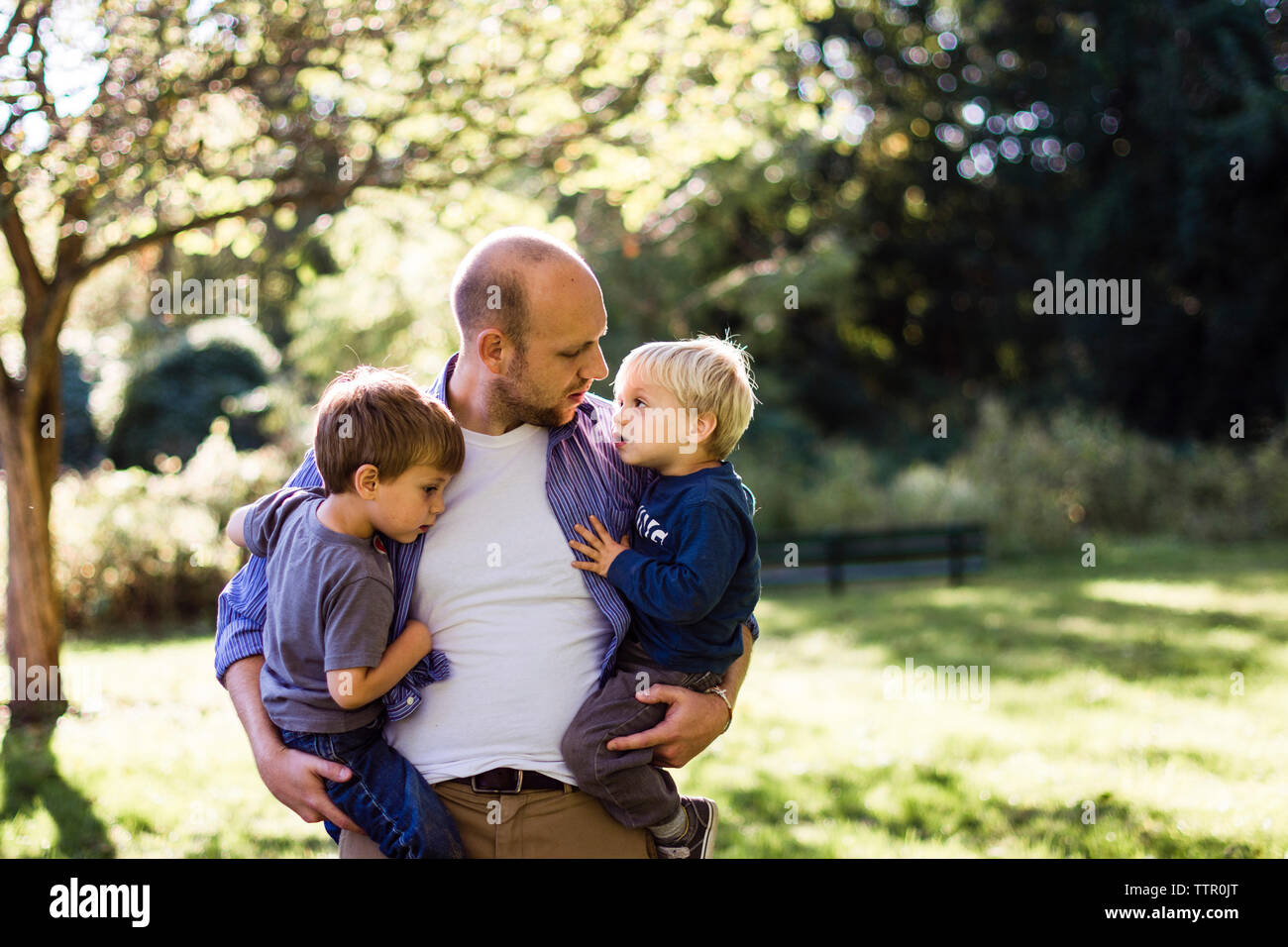 Boys carrying old man hi-res stock photography and images - Alamy