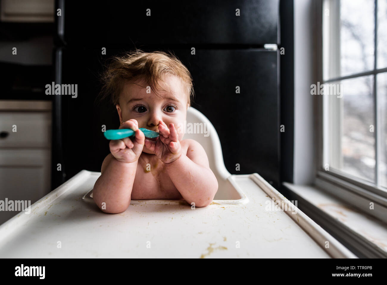 Baby messy eating hi-res stock photography and images - Alamy
