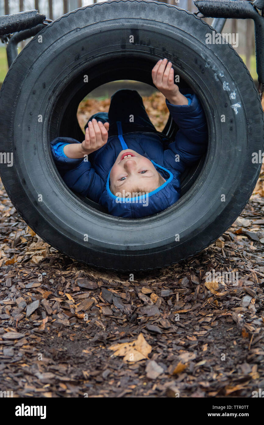 Boy with tire hi-res stock photography and images - Alamy
