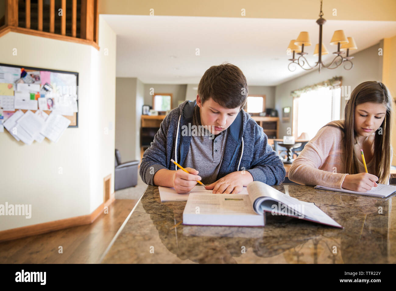 Brother and sister writing hi-res stock photography and images - Alamy