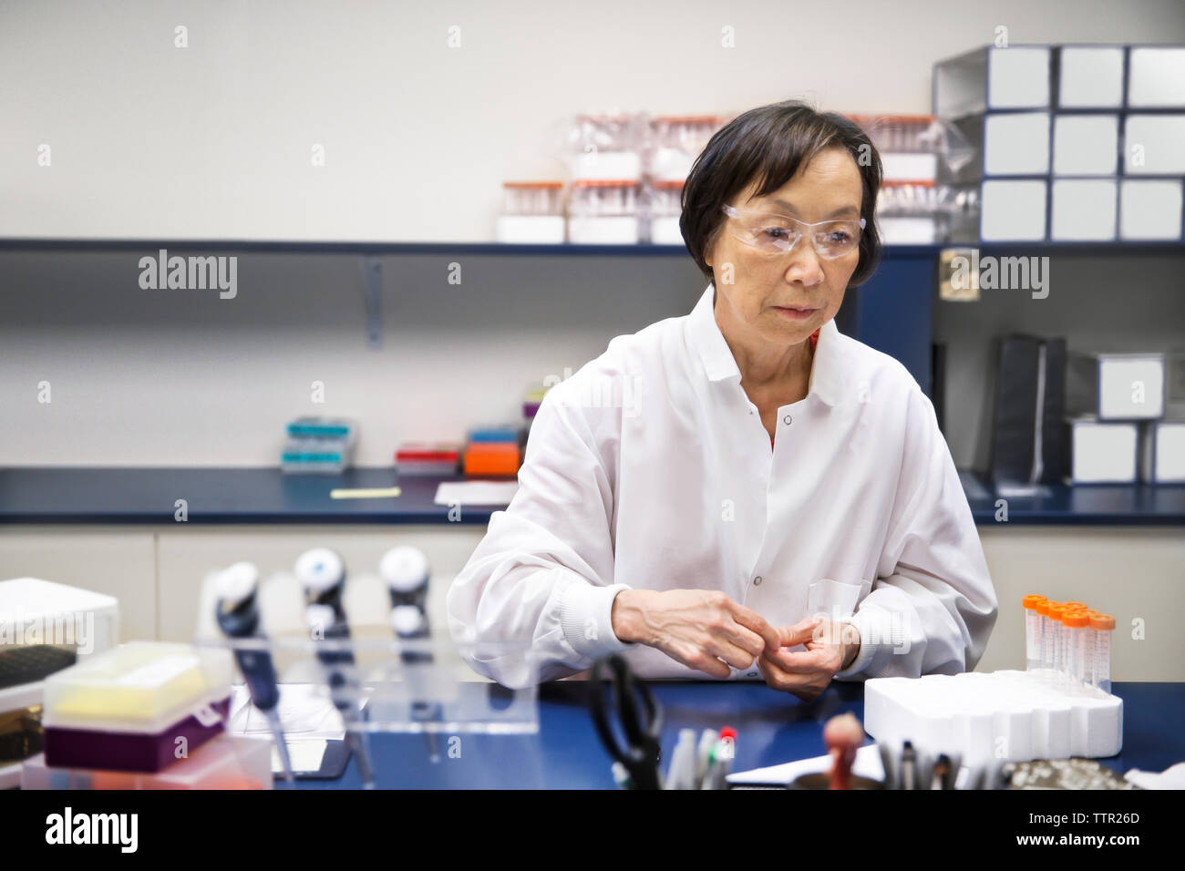 Senior female scientist working in laboratory Stock Photo - Alamy