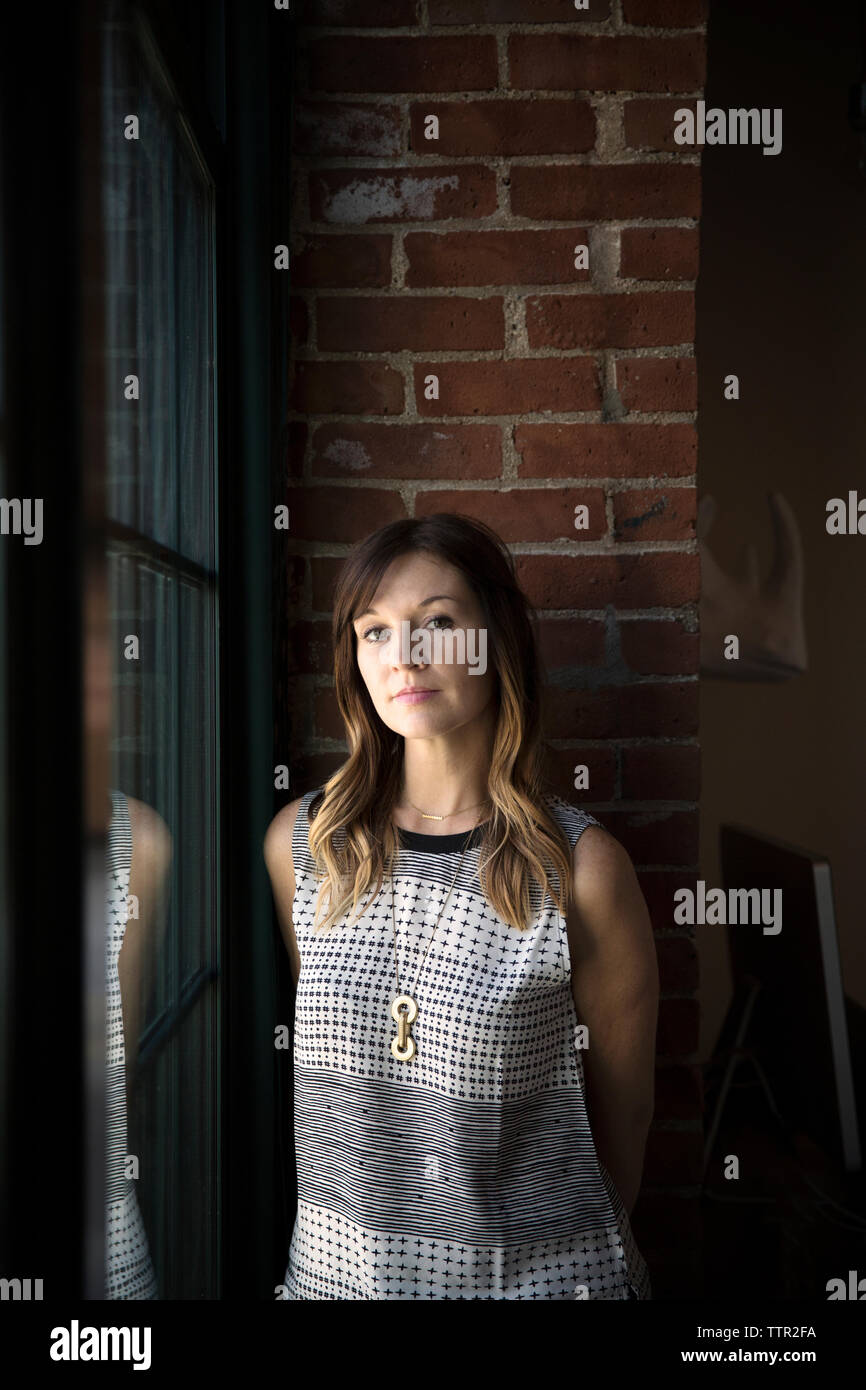 Woman standing window home beautiful woman hi-res stock photography and ...