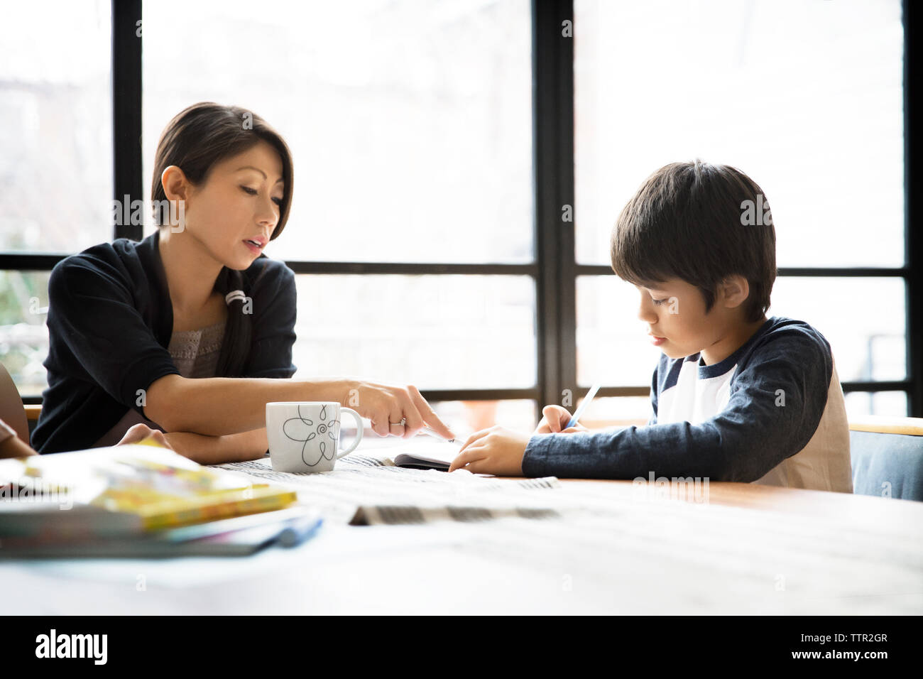 Homework mother son hi-res stock photography and images - Alamy