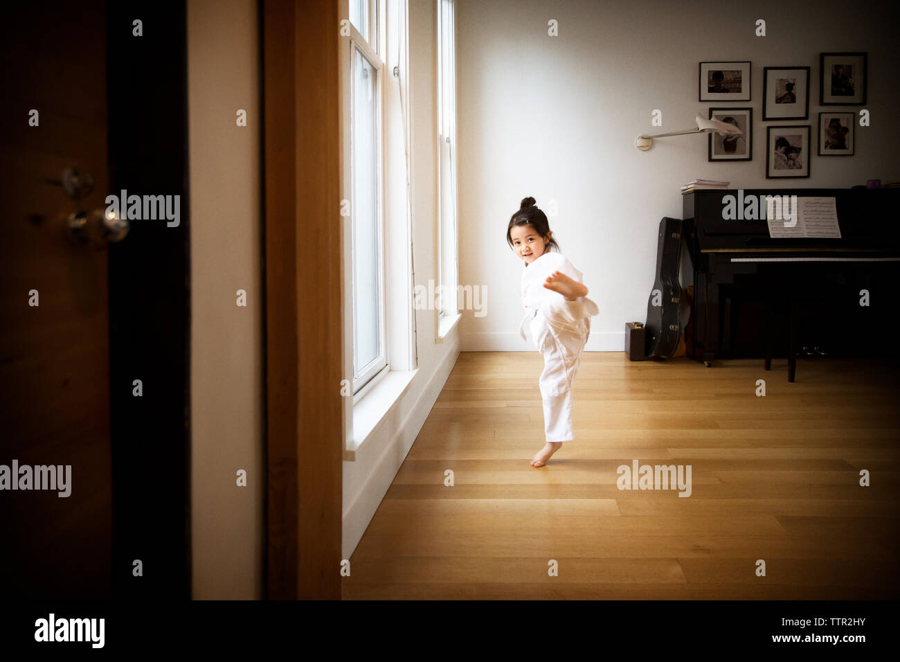 Girl practicing karate at home Stock Photo - Alamy