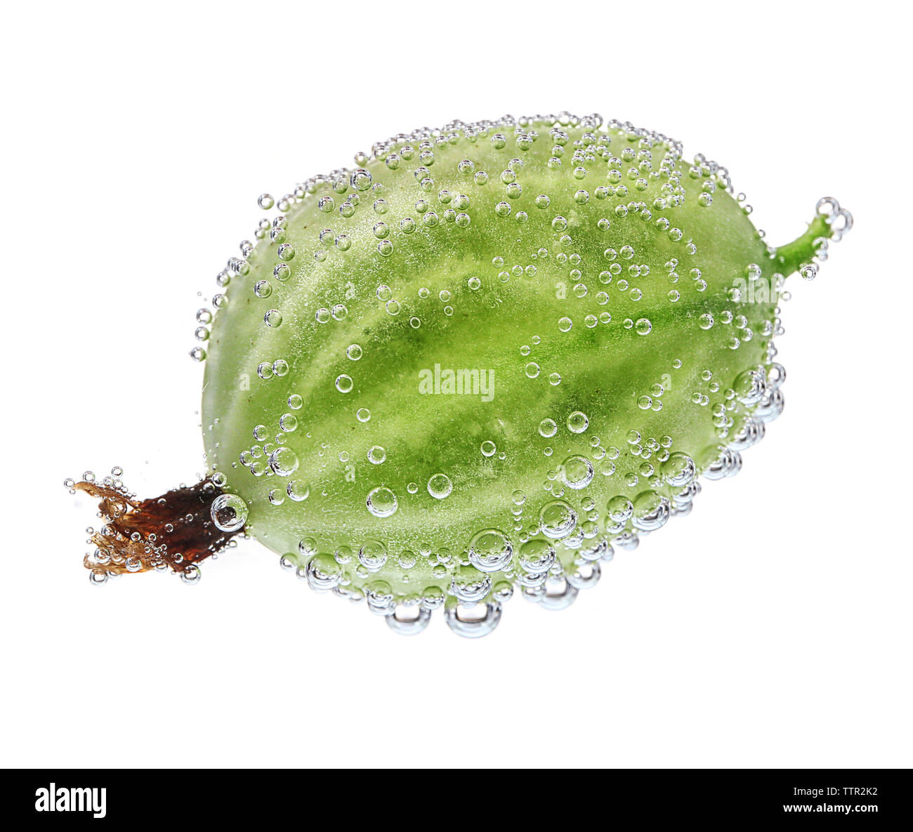 Gooseberry in a water on white background Stock Photo - Alamy