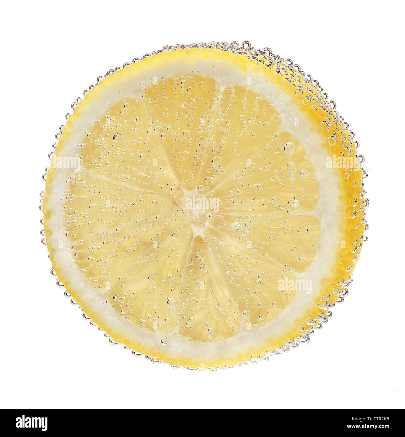 Lemon slice in a water on white background Stock Photo - Alamy