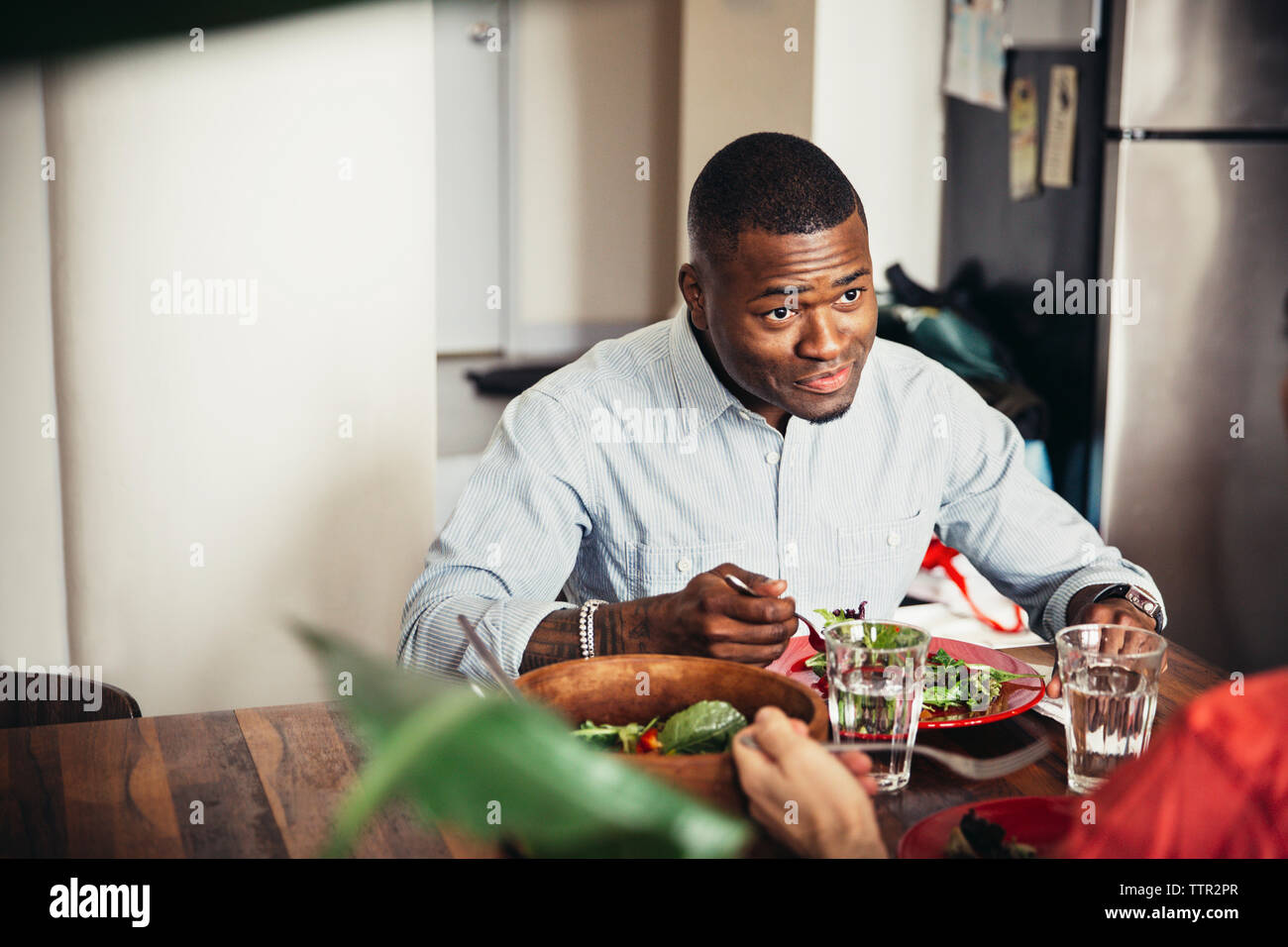 Smiling man eating and drinking hi-res stock photography and images - Alamy