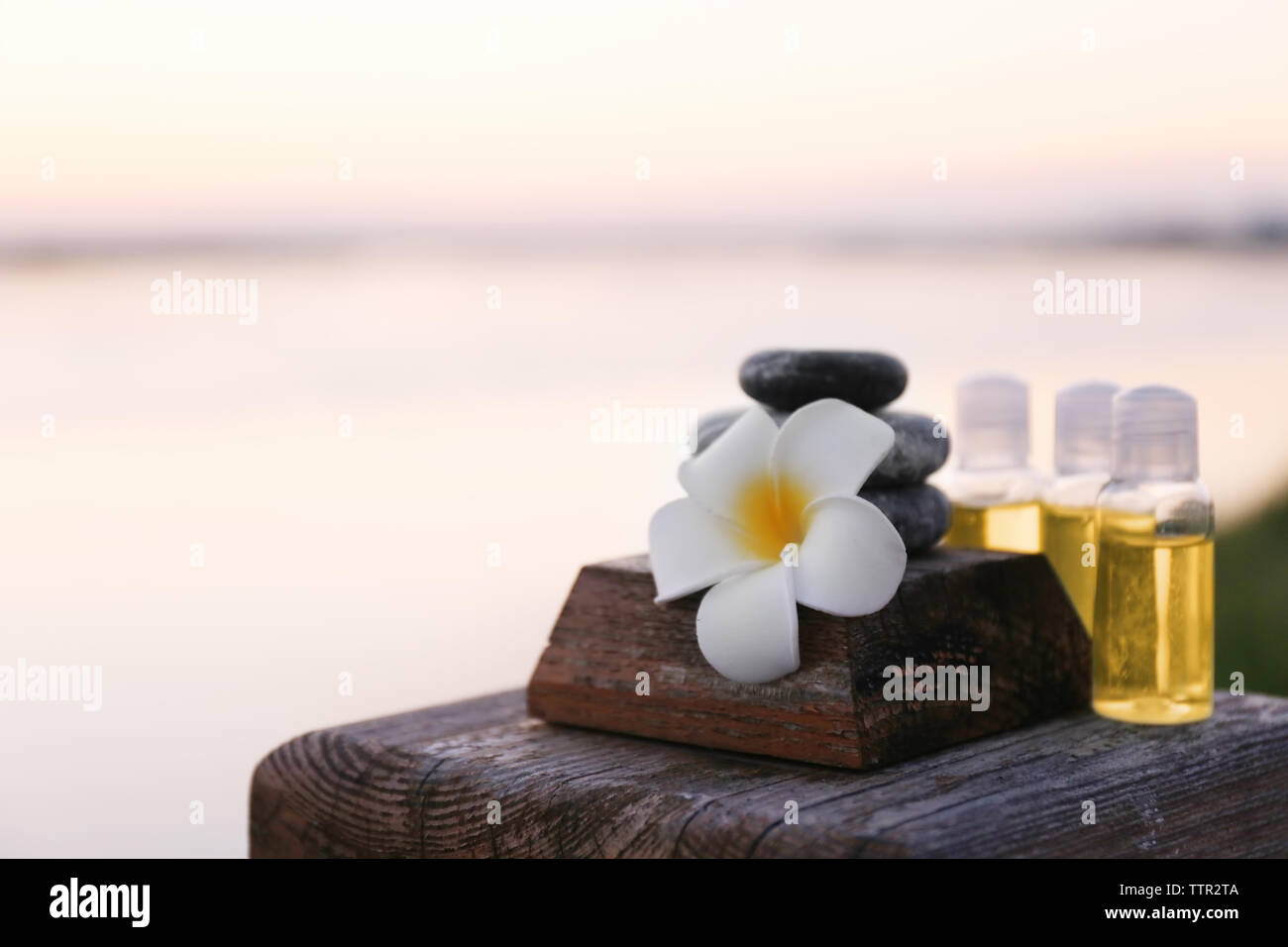 Spa composition on sunset background Stock Photo - Alamy