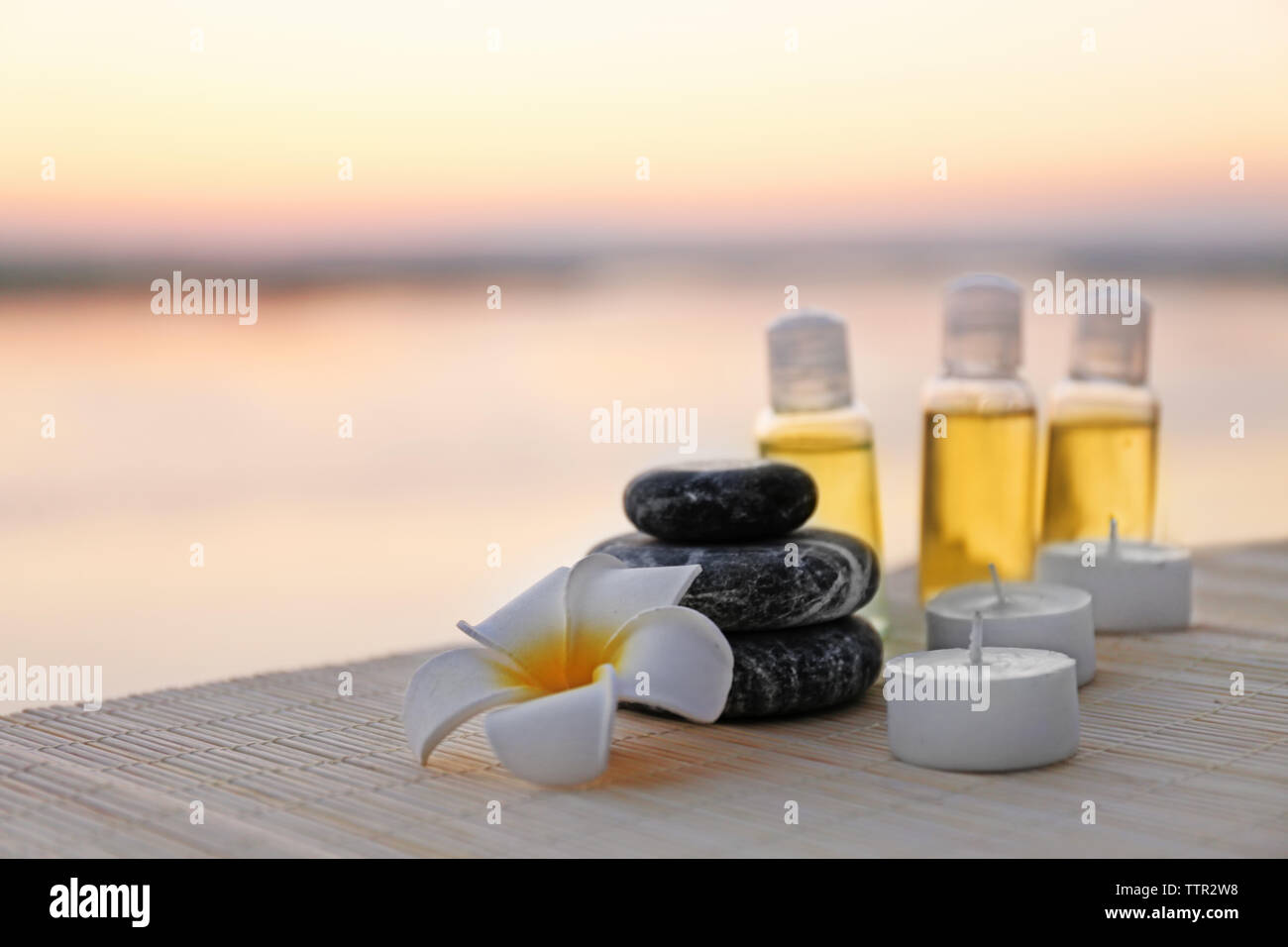 Spa composition on sunset background Stock Photo - Alamy