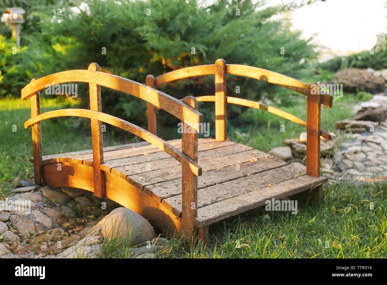 Wooden bridge in beautiful park Stock Photo - Alamy
