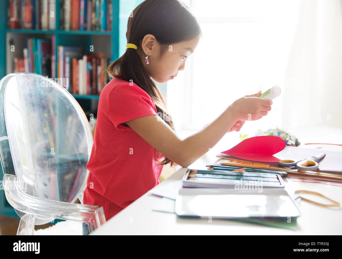 Close-up of girl making greeting card on table at home Stock Photo - Alamy