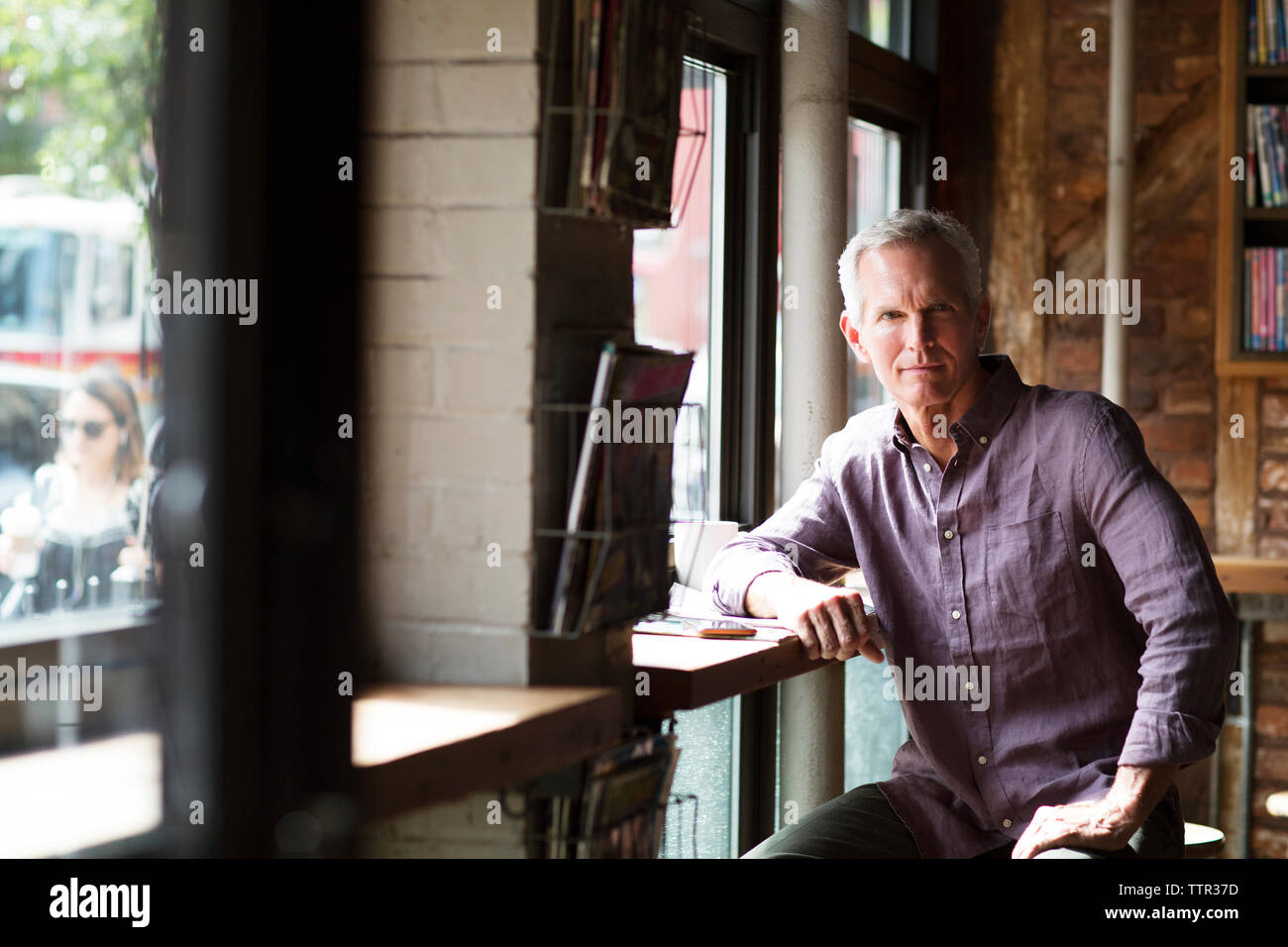 Old man sitting in cafe hi-res stock photography and images - Alamy
