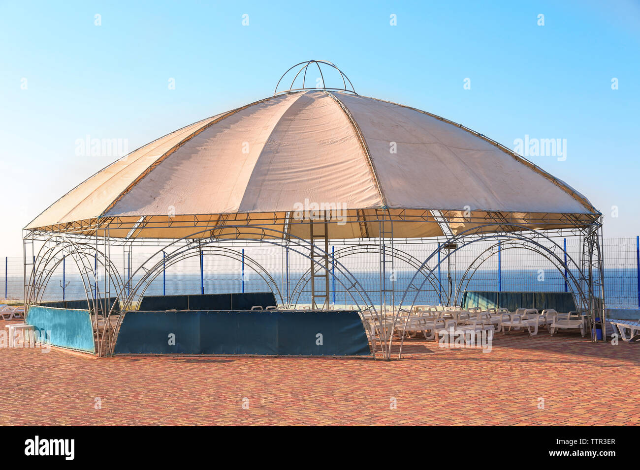 Empty sunbeds under a canopy Stock Photo - Alamy