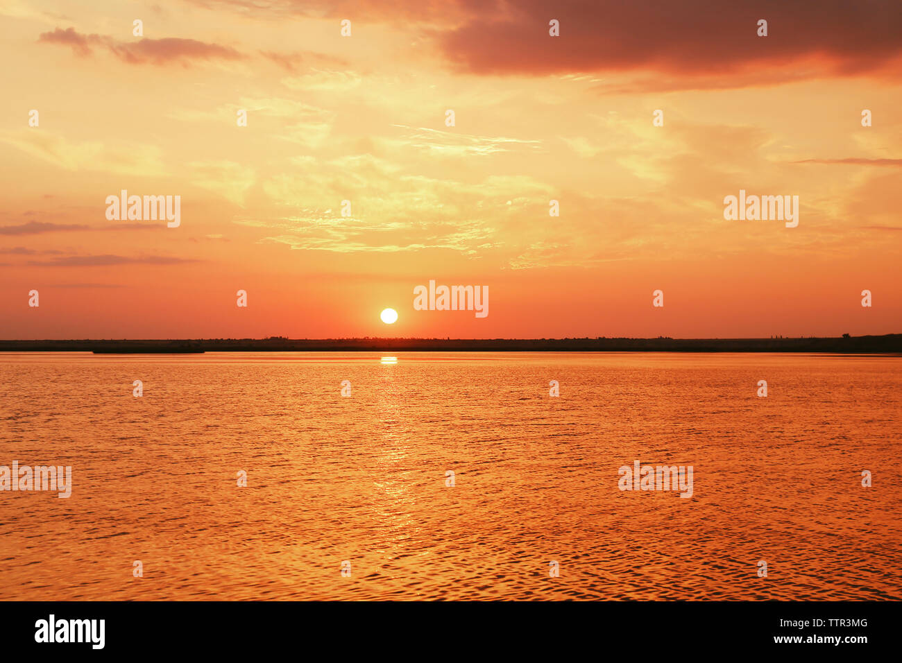Beautiful sunset sky above sea water Stock Photo - Alamy