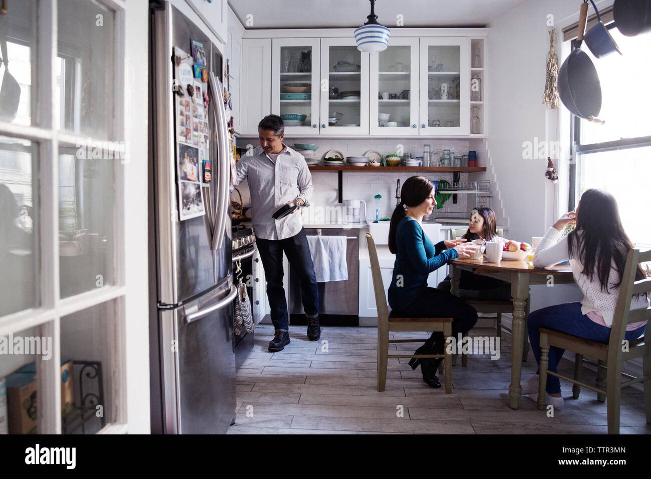 Family breakfast woman standing hi-res stock photography and images - Alamy
