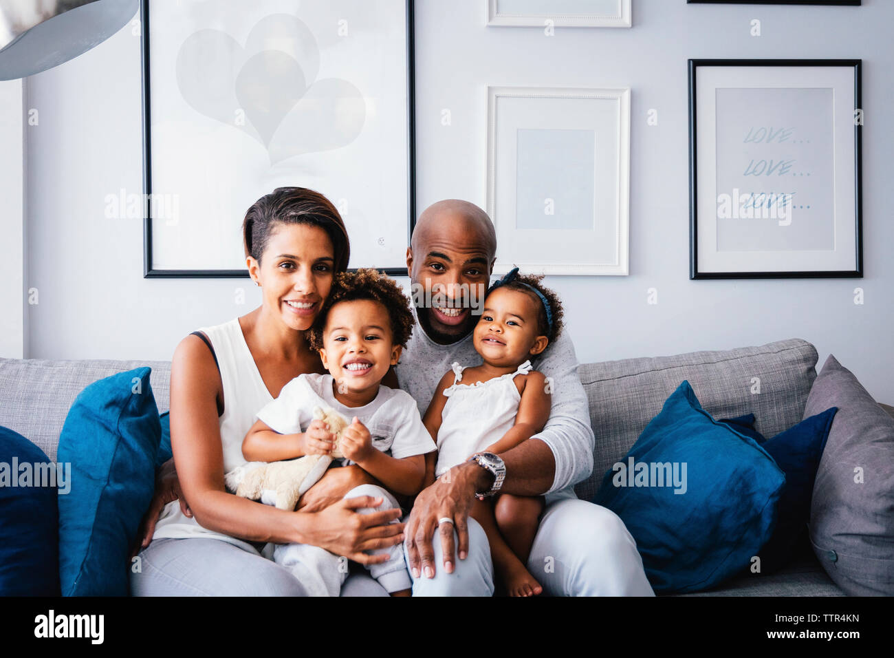 Mother baby girl sitting wall hi-res stock photography and images - Alamy