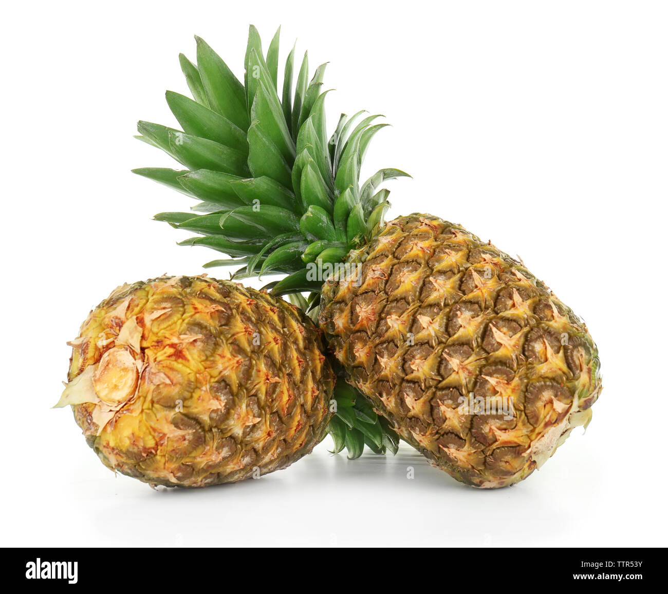 Pineapples, isolated on white Stock Photo - Alamy