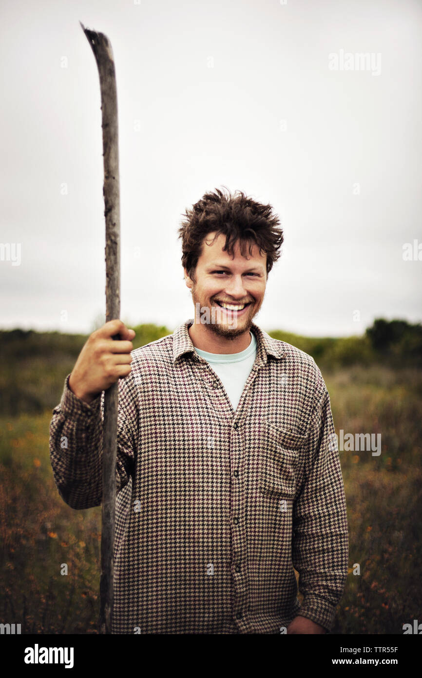 Man holding stick hi-res stock photography and images - Alamy