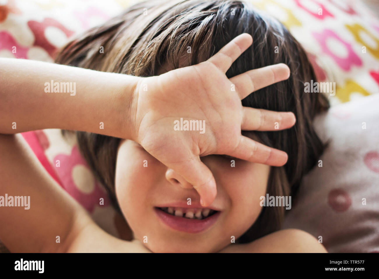 Boy hand covering face hi-res stock photography and images - Alamy