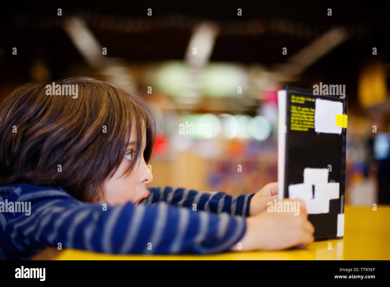 Boy book library hi-res stock photography and images - Alamy