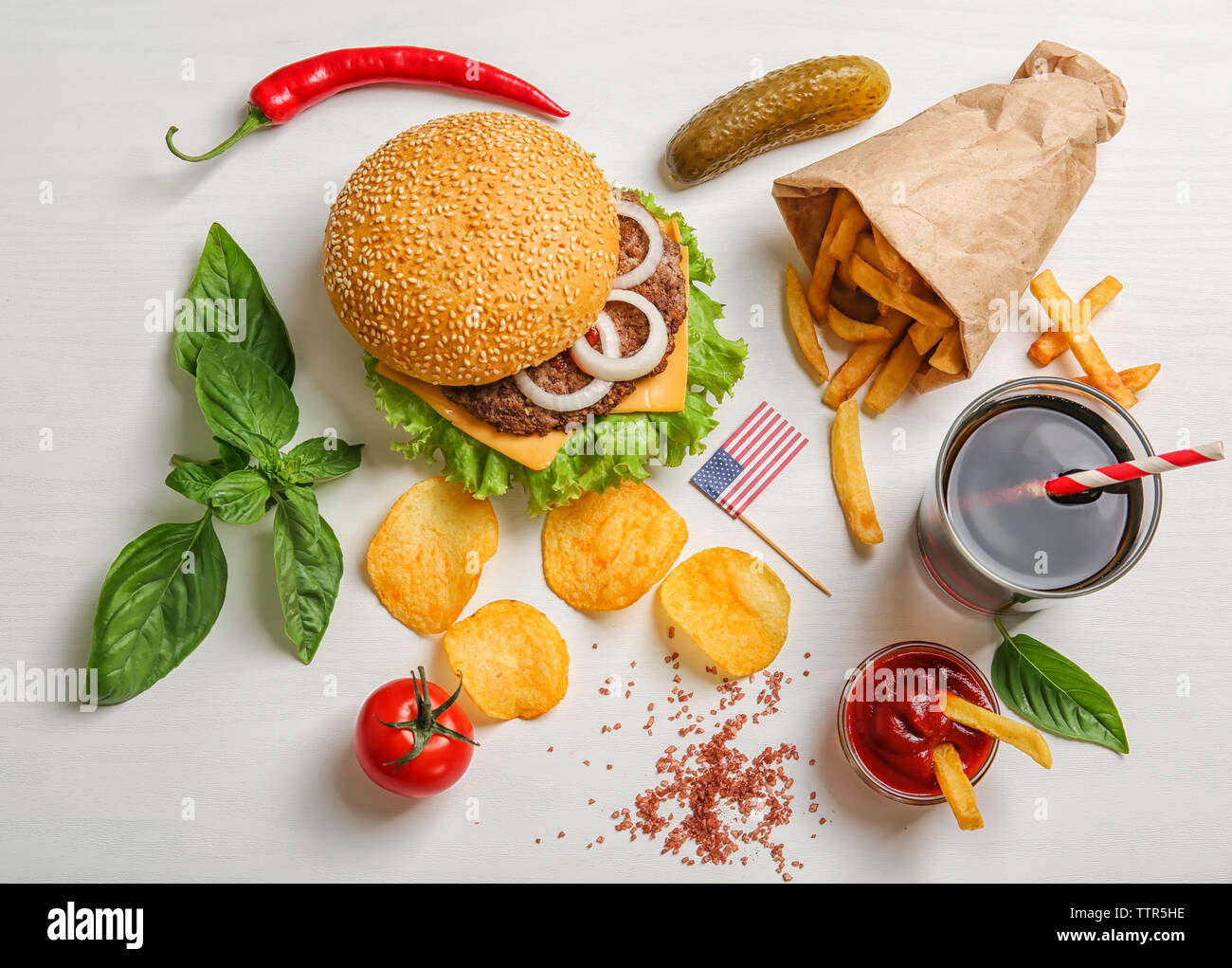 Fresh hamburger with French fries on white background Stock Photo - Alamy