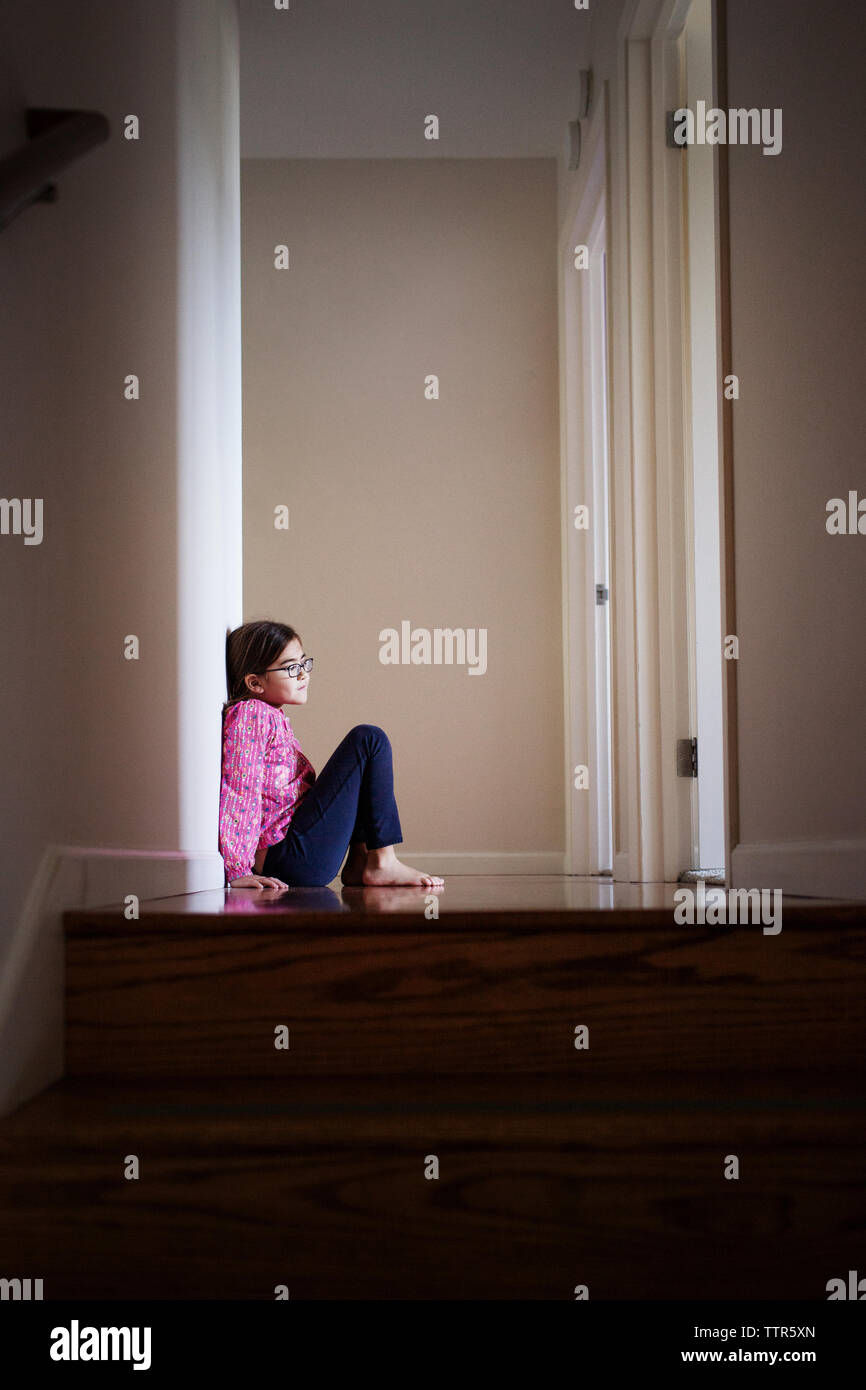 Girl sitting on wall hi-res stock photography and images - Alamy