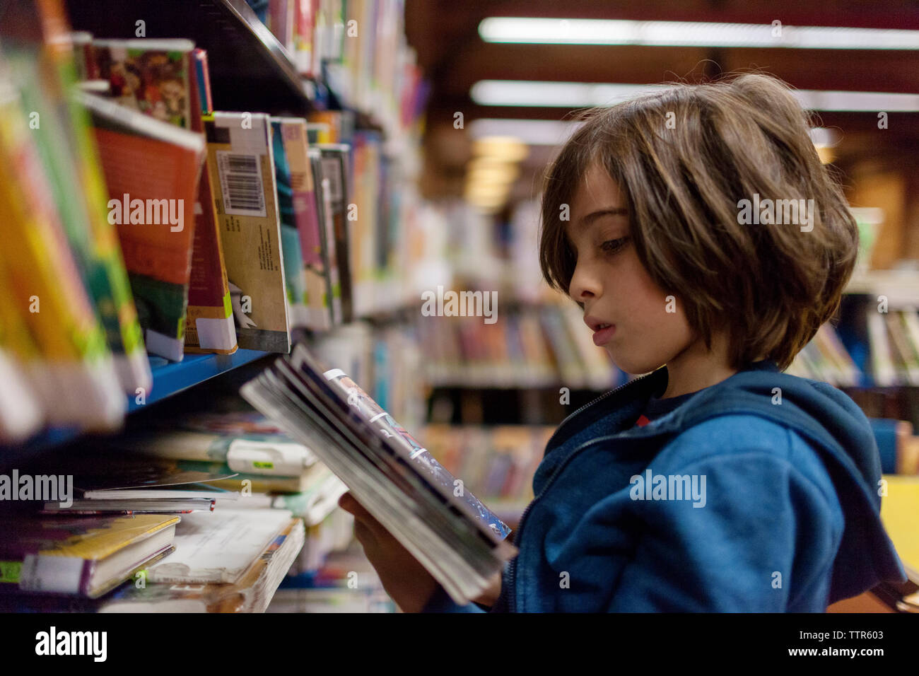 Boy reading comic book hi-res stock photography and images - Alamy