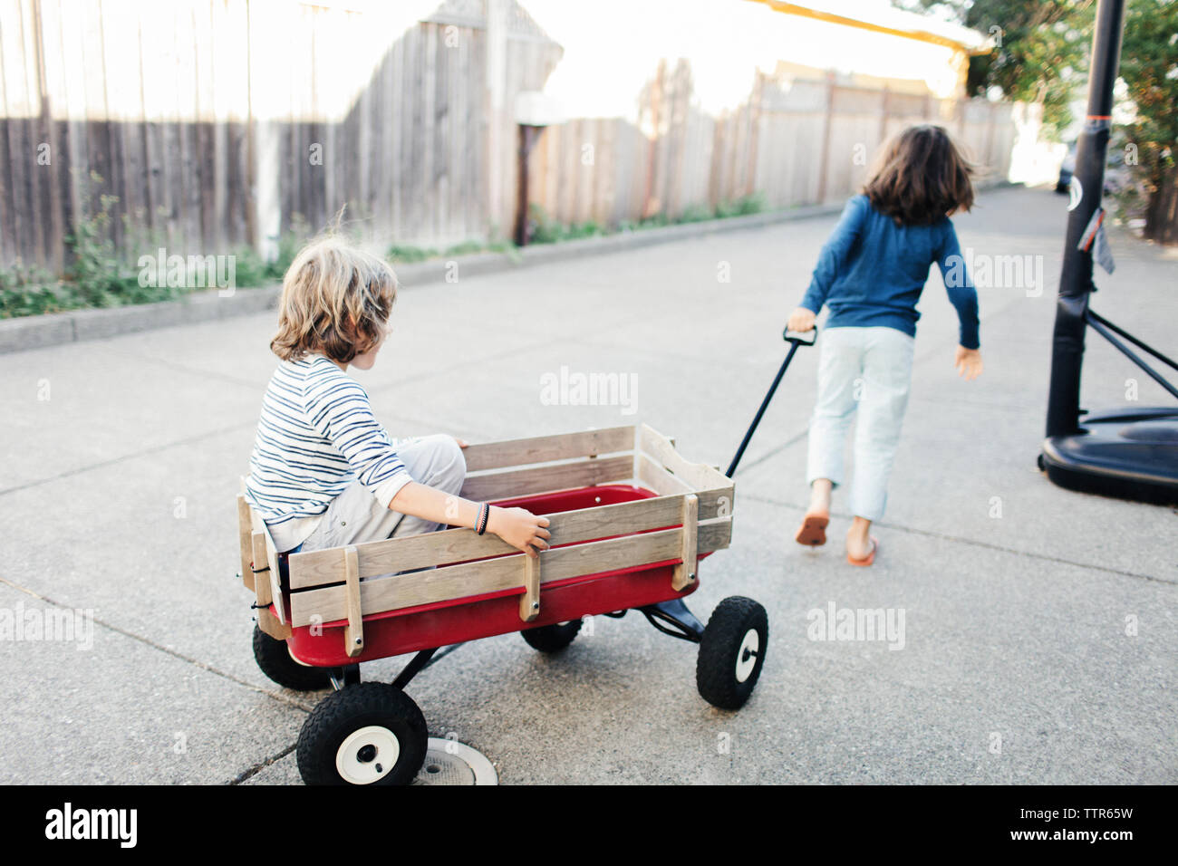 Boy Pulling Wagon High Resolution Stock Photography and Images - Alamy